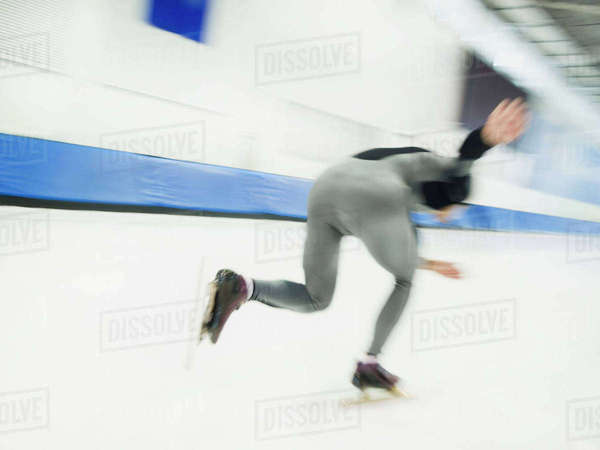 Male speed skater skating - Stock Photo - Dissolve