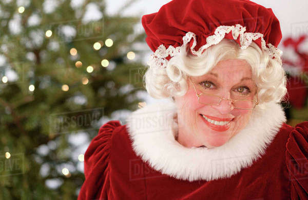 Portrait of smiling Mrs. Claus - Stock Photo - Dissolve