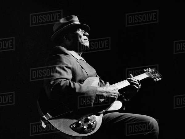 African American man playing guitar - Royalty-free Stock Photo | Dissolve