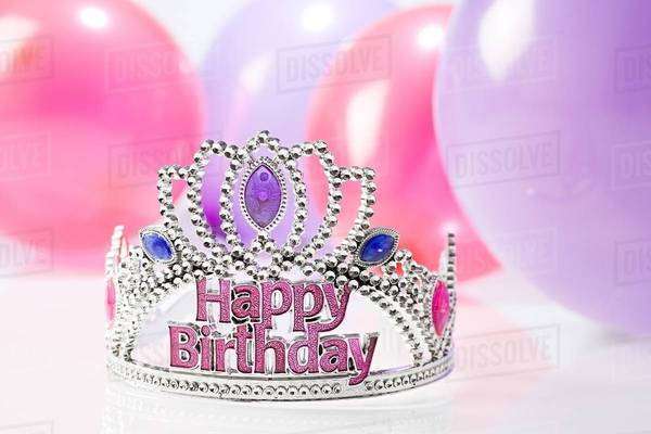 Happy birthday crown and balloons - Royalty-free Stock Photo | Dissolve