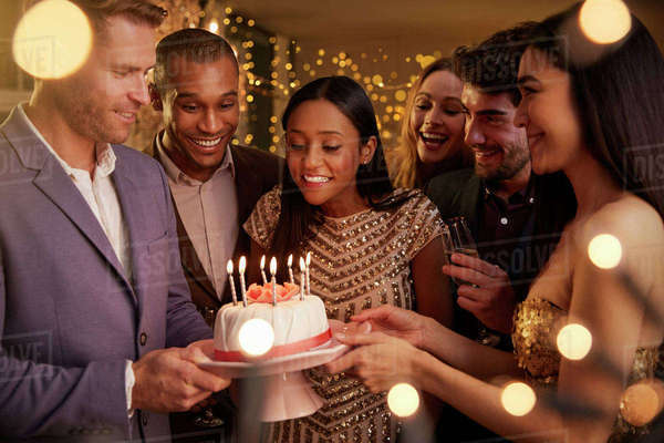 Group of friends celebrating birthday with party at home - Royalty-free ...