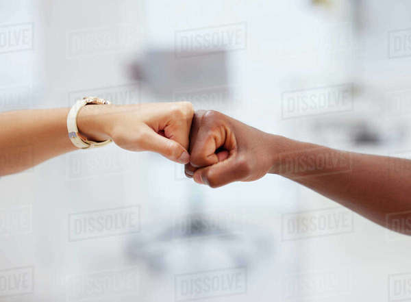 Closeup of people, hands and fist bump for success, winning teamwork and agreement for power ...