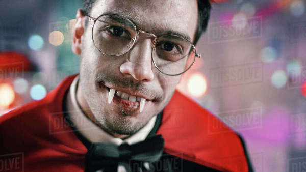 Halloween Costume Party: Close-up Portrait of Count Dracula Smiling Creepily, Shows His Deadly ...