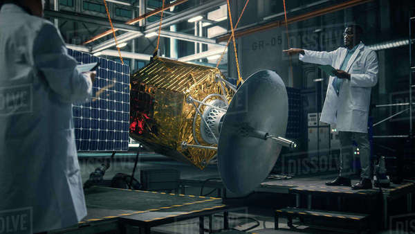 Engineer and Technician Working on Satellite Construction. Aerospace ...