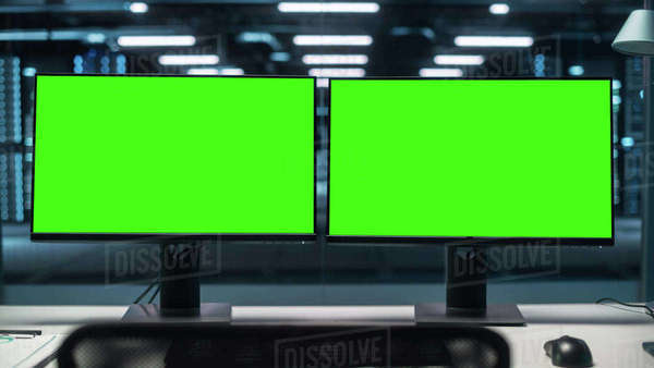 Professional IT Programer Working in Data Center on Desktop Computer with Two Displays, while ...