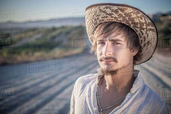 Viticulturist working in vineyard, Cagliari, Sardinia, Italy - Stock Photo - Dissolve