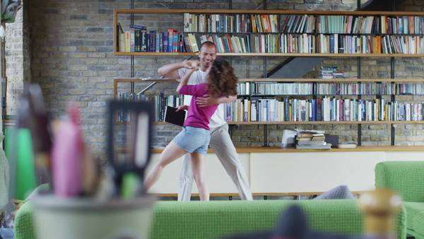 Spontaneous young man takes his partner by surprise with a dance ...