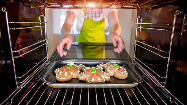 Baking Gingerbread man in the oven, view from the inside of the oven ...