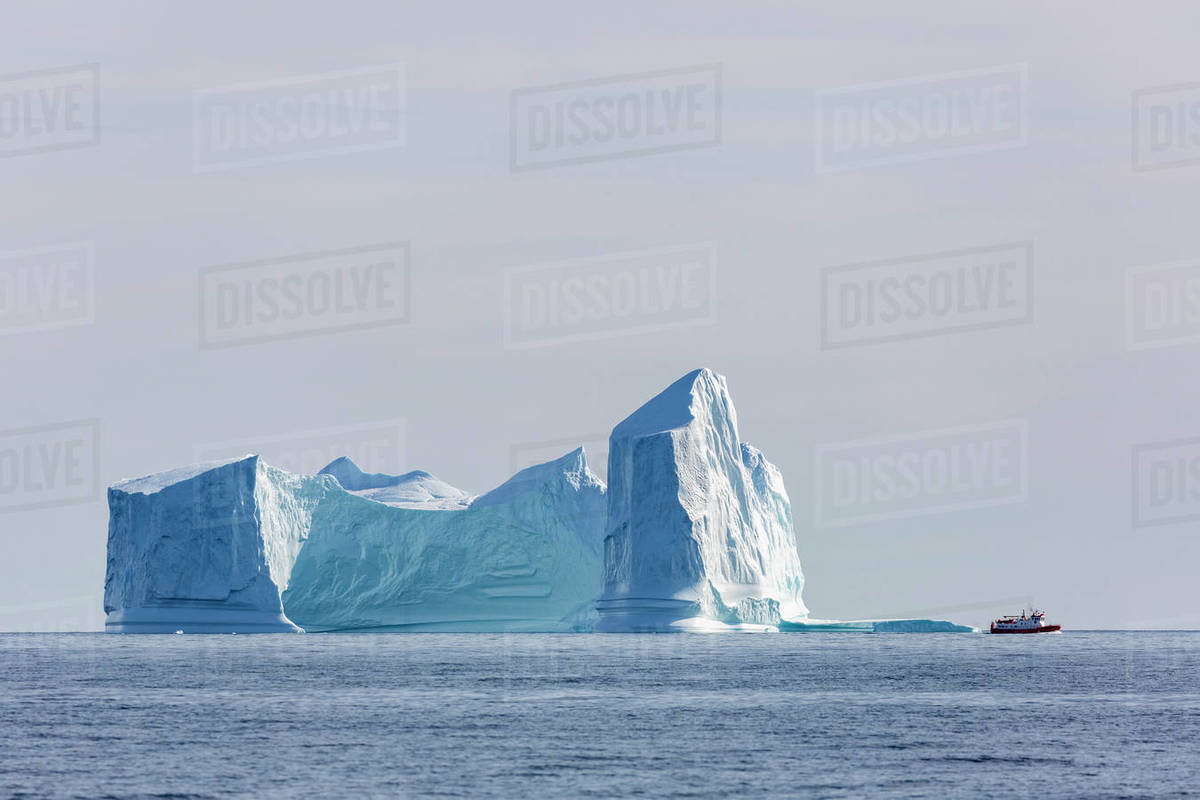 Majestic iceberg formations on sunny blue Atlantic Ocean Greenland ...