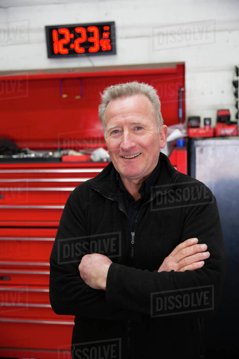 Portrait confident male mechanic in auto repair shop - Royalty-free ...