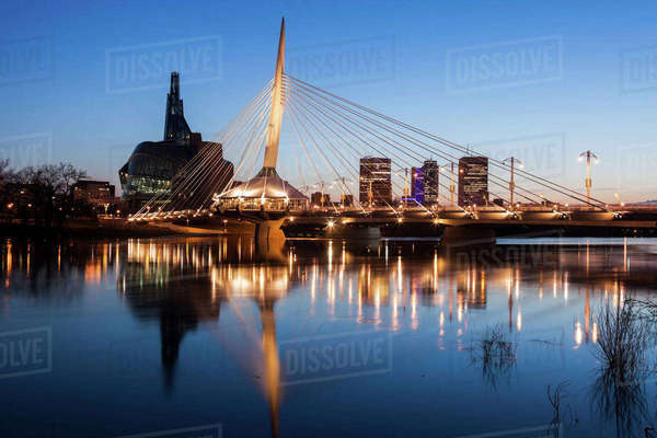 Canada, Manitoba, Winnipeg, Red river reflecting Esplanade Riel Bridge ...