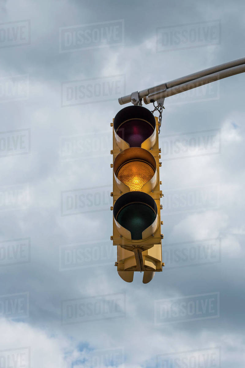Traffic light against storm clouds - Royalty-free Stock Photo | Dissolve