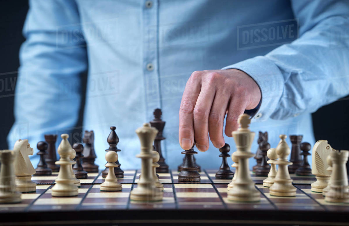 Hand of man playing chess - Royalty-free Stock Photo | Dissolve