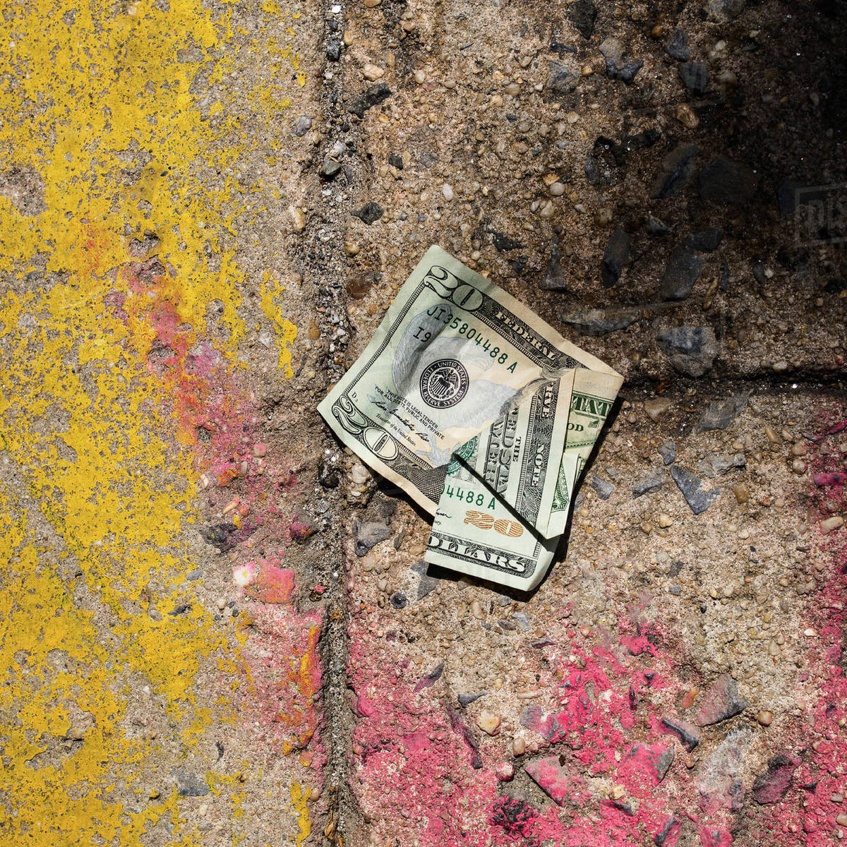 Crumpled money on sidewalk - Royalty-free Stock Photo | Dissolve