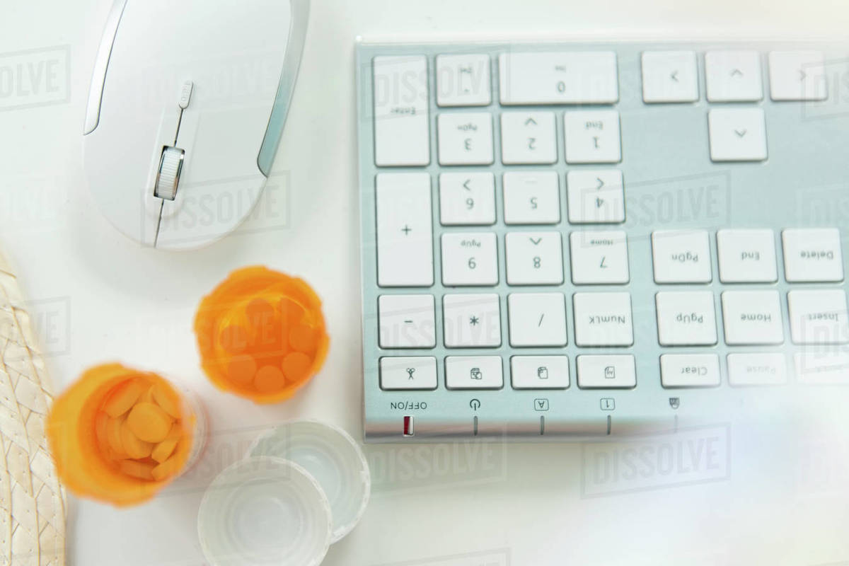Open pill bottles by computer keyboard and mouse - Royalty-free Stock ...