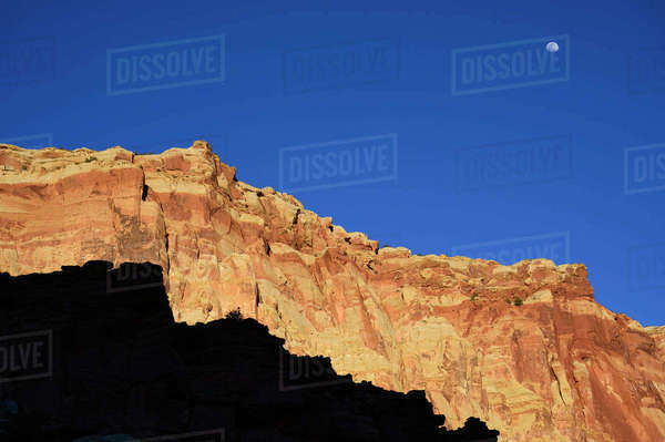 Moon over cliff in shadow in Capitol Reef National Park, USA - Stock ...