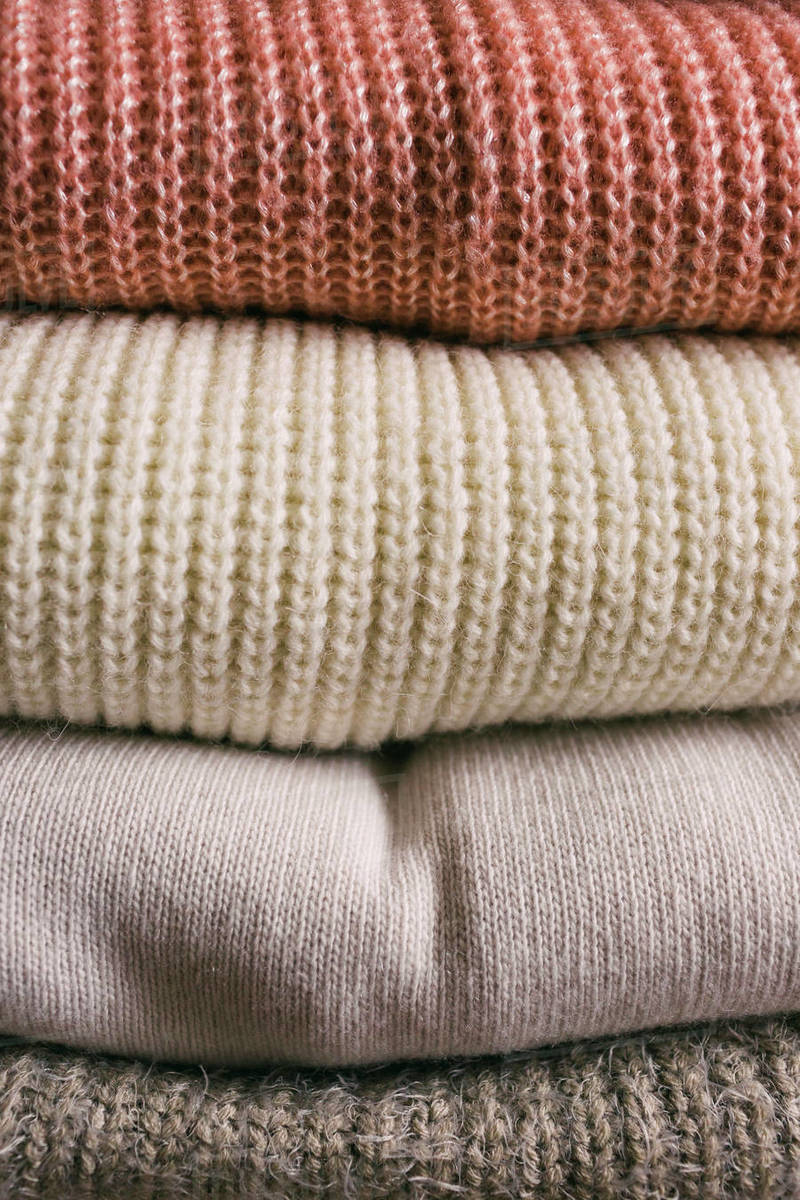 Stack of folded sweaters - Royalty-free Stock Photo | Dissolve