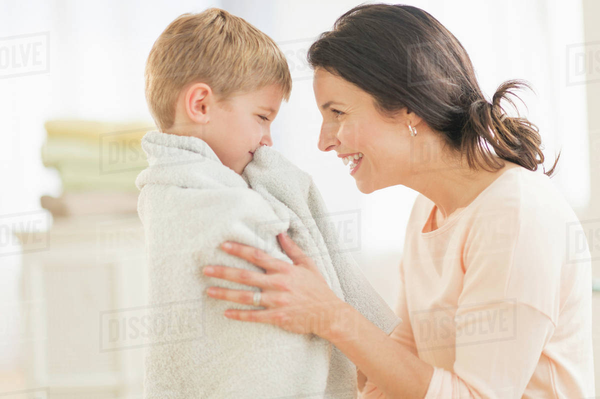 Mother with son (6-7) wrapped in towel - Royalty-free Stock Photo ...