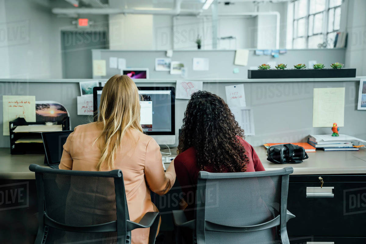 Women using computer in office - Royalty-free Stock Photo | Dissolve