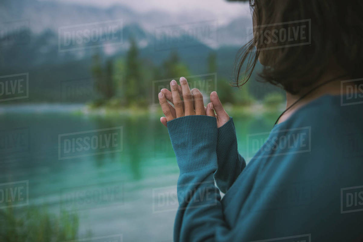 Germany, Bavaria, Eibsee, Young woman standing by Eibsee lake in ...