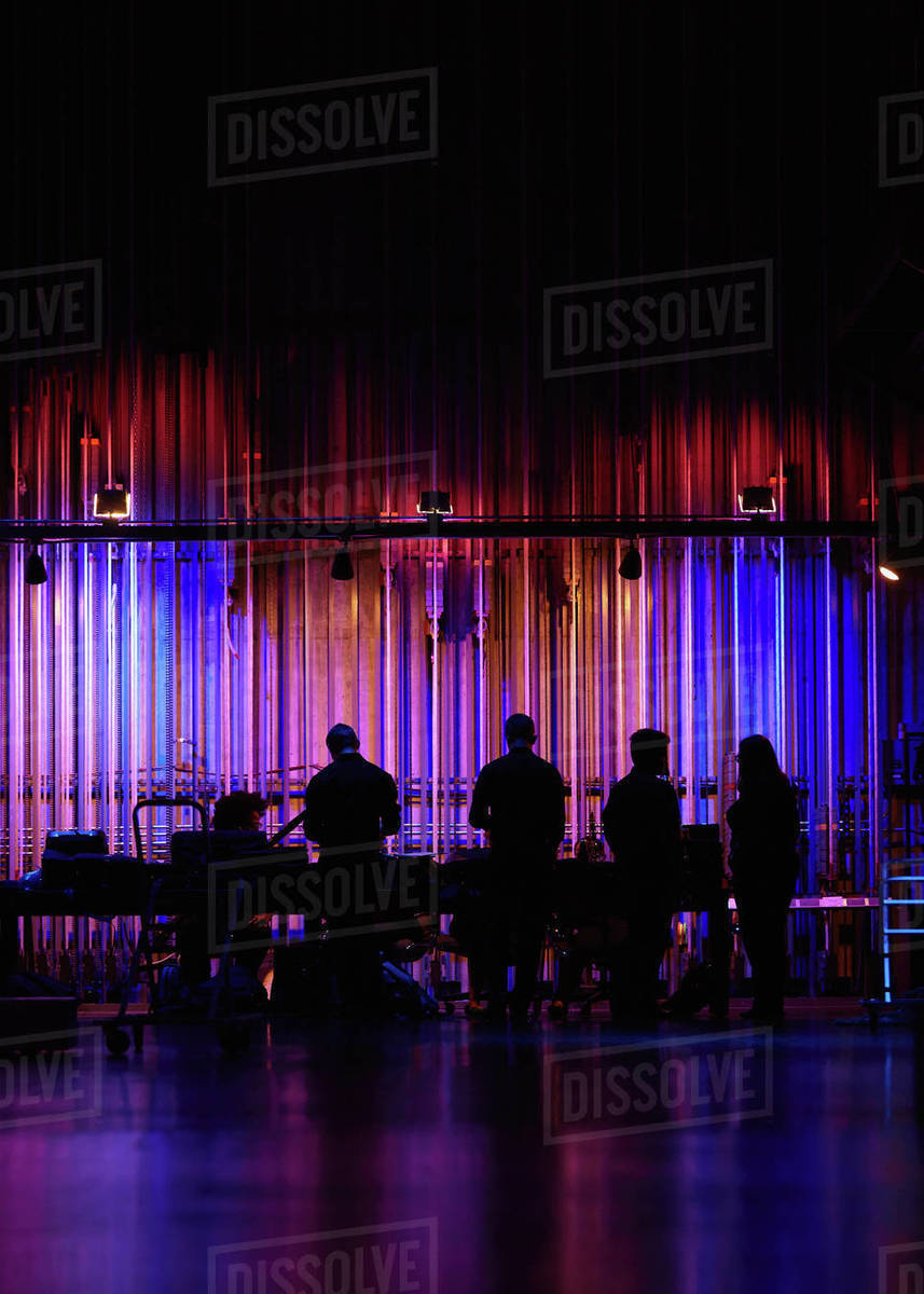 Silhouettes of musicians backstage - Stock Photo - Dissolve
