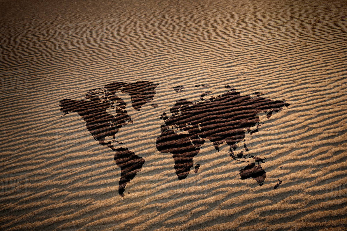 World map against desert sand - Stock Photo - Dissolve