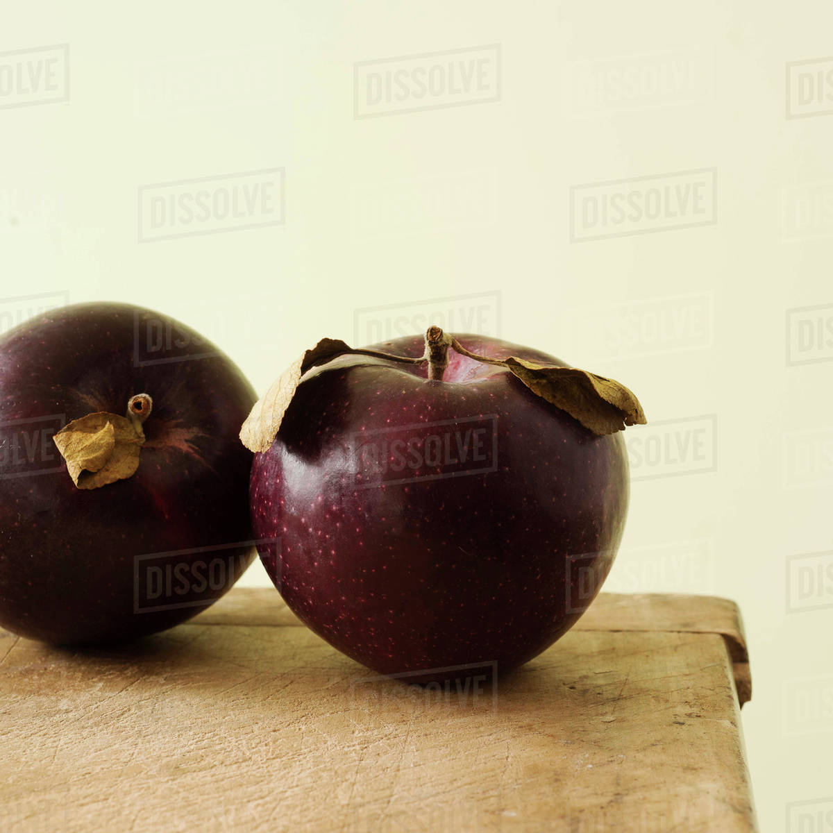 Studio shot of purple apples - Royalty-free Stock Photo | Dissolve