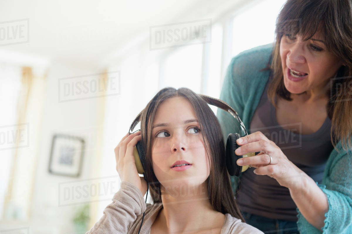 Mom yelling at teenage daughter (14-15) - Stock Photo - Dissolve
