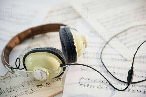 Headphones and music sheets - Royalty-free Stock Photo | Dissolve