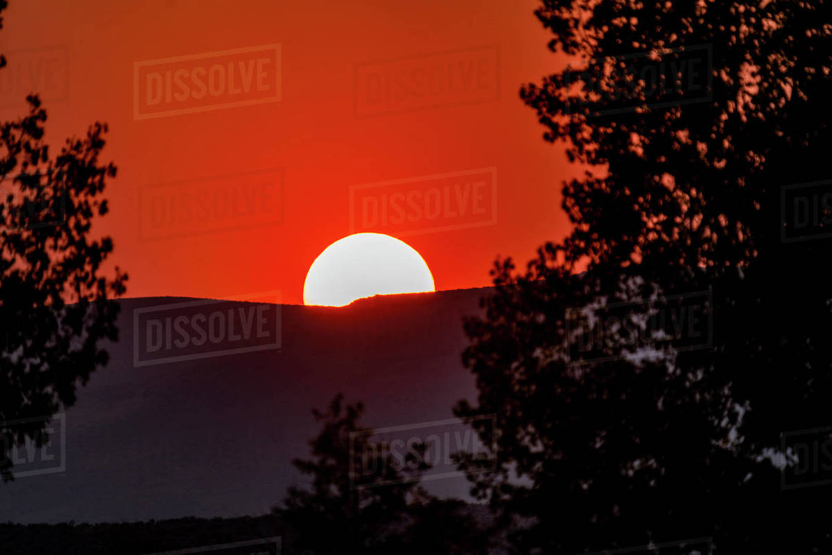United States, Idaho, Sun Valley, Sun setting over hills - Royalty-free ...