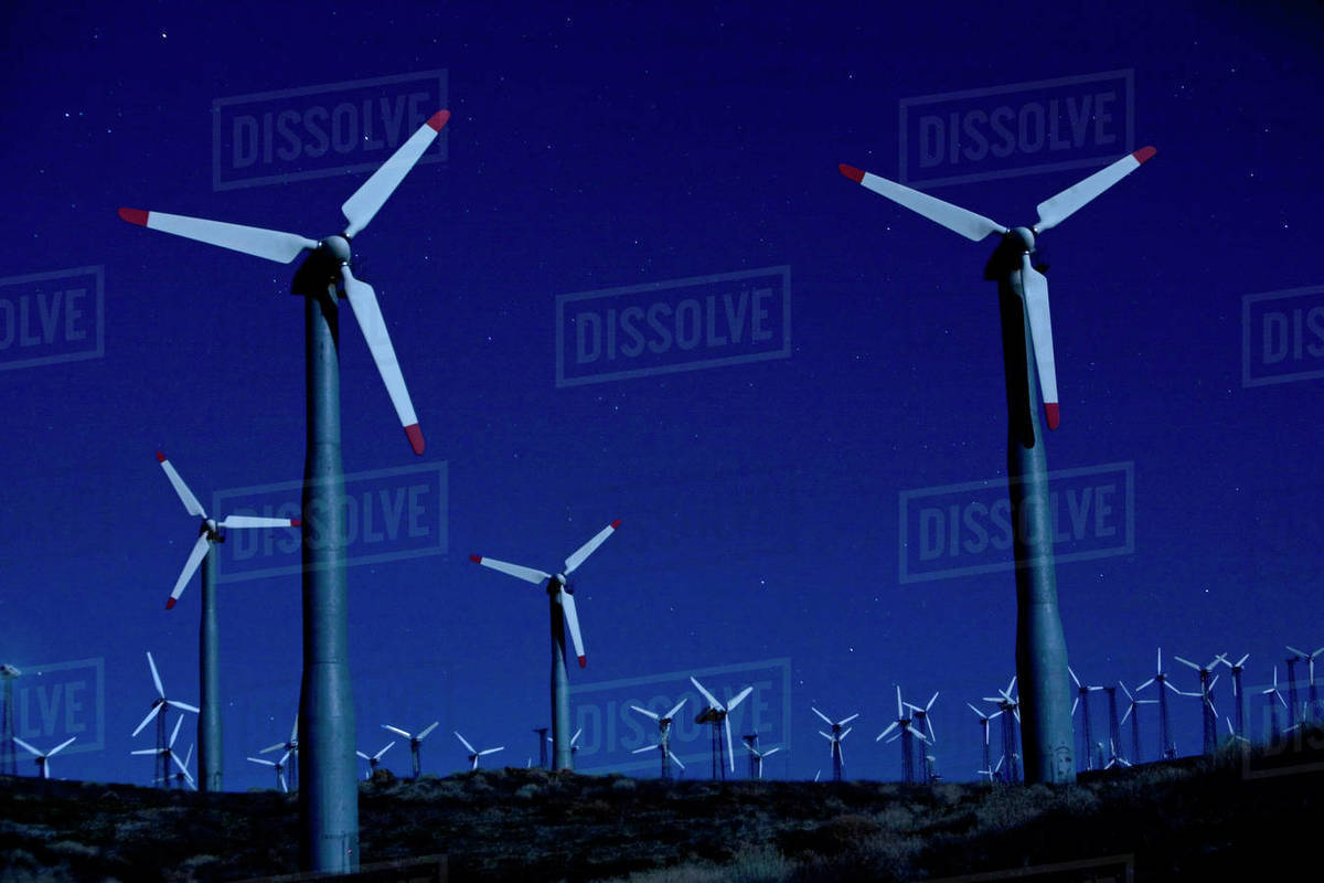 Wind turbines in landscape at night - Royalty-free Stock Photo | Dissolve