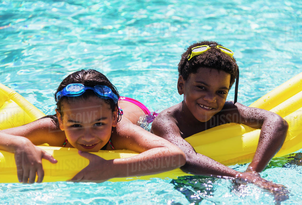 Portrait of kids( 6-7, 8-9) with pool raft - Royalty-free Stock Photo ...