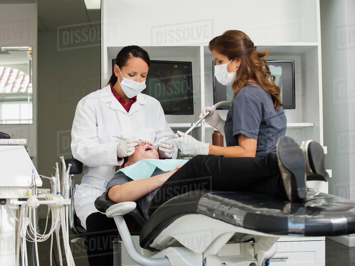 Dentist operation on patient - Royalty-free Stock Photo | Dissolve