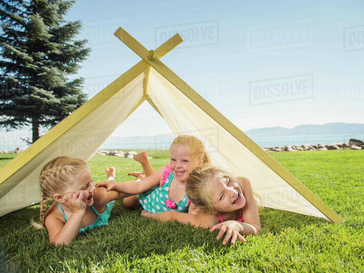 Three girls (2-3, 4-5) playing in tent - Royalty-free Stock Photo ...