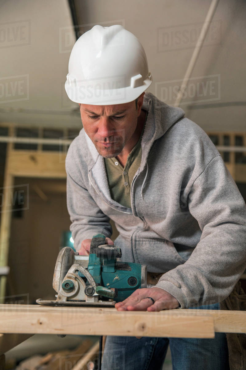 Lumber at work on new structure - Royalty-free Stock Photo | Dissolve