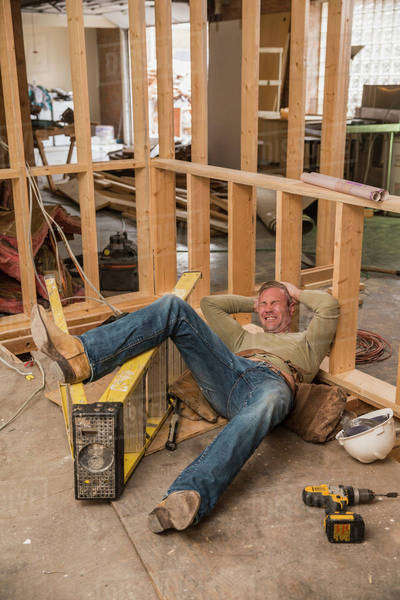 Construction worker falling of ladder inside new structure - Stock ...