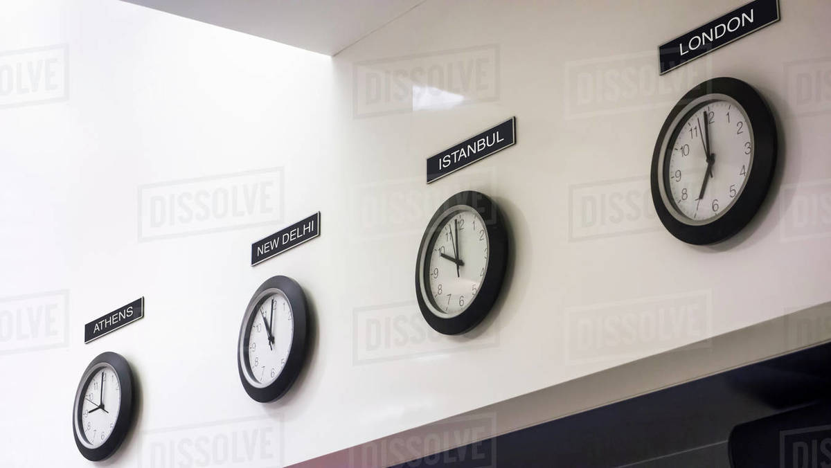 Time zone clocks in a row on wall - Royalty-free Stock Photo | Dissolve