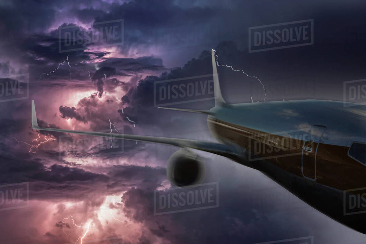Airplane flying in thunderstorm - Stock Photo - Dissolve