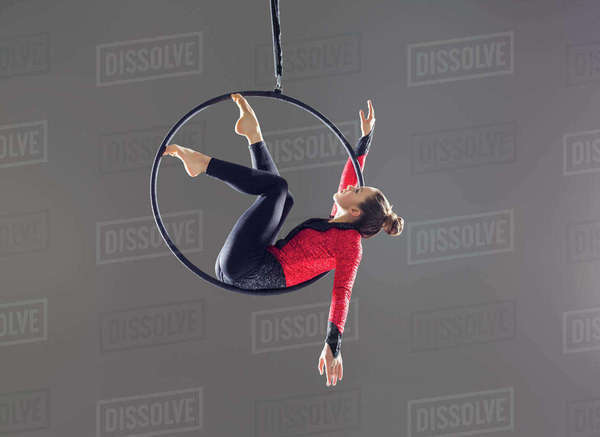 Young acrobat performing on aerial hoop - Royalty-free Stock Photo ...