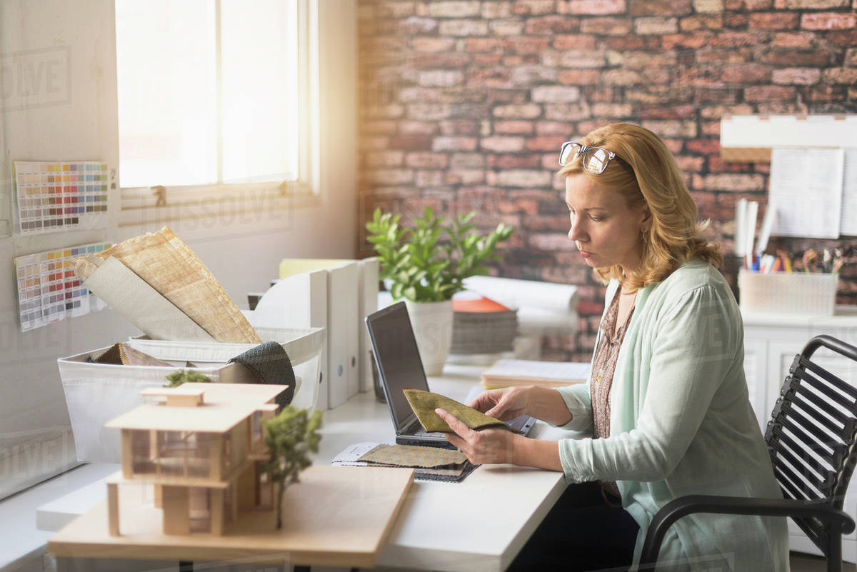 Female interior designer at work - Royalty-free Stock Photo | Dissolve