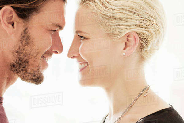 Couple face to face on white background - Stock Photo - Dissolve
