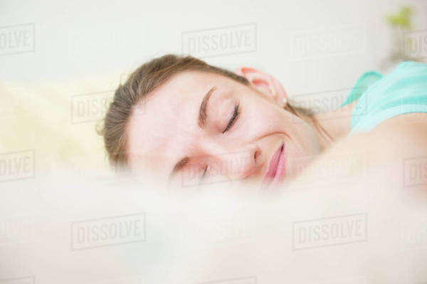 Woman smiling in sleep - Royalty-free Stock Photo | Dissolve