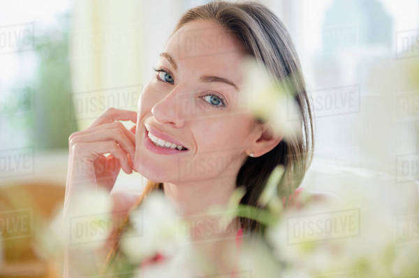Portrait of smiling woman at home - Royalty-free Stock Photo | Dissolve