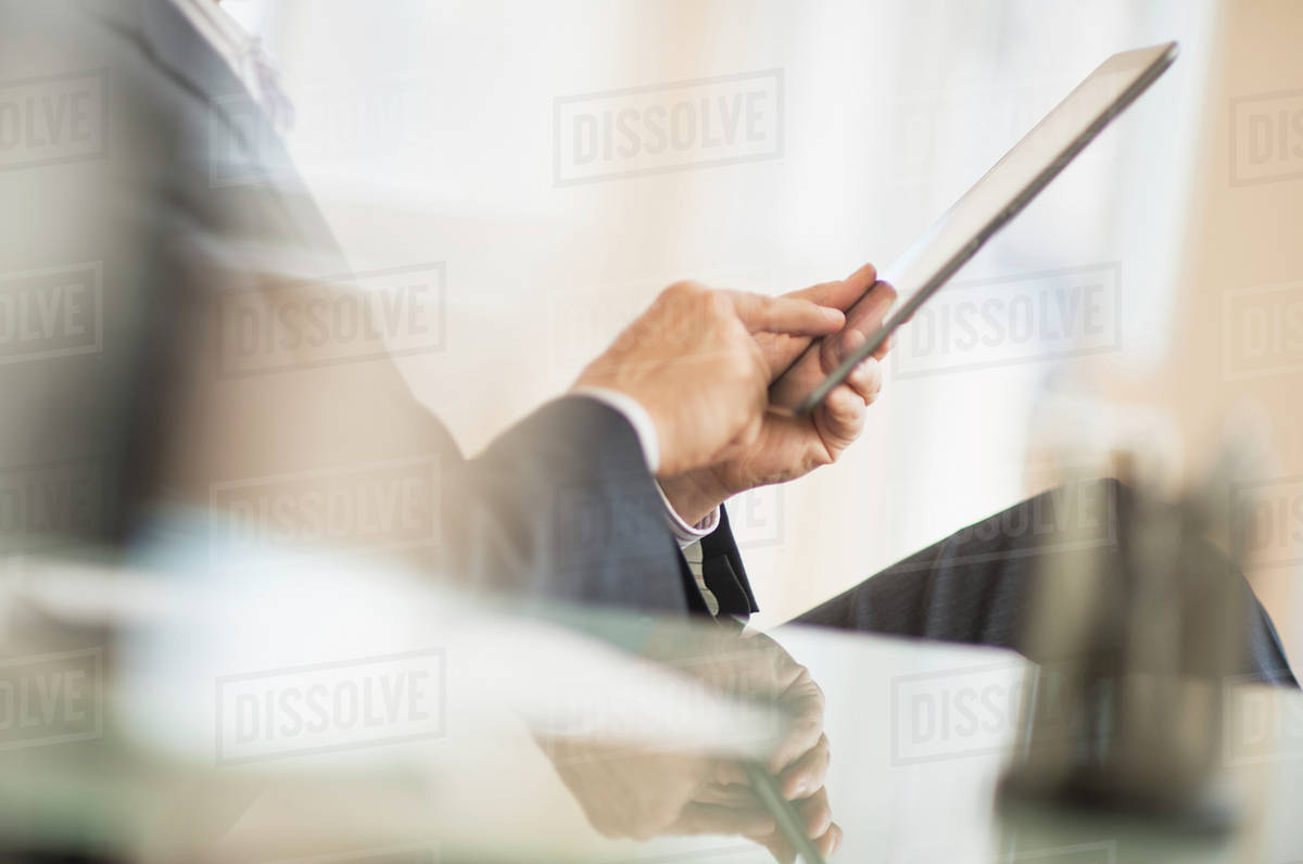 Man using tablet pc - Royalty-free Stock Photo | Dissolve