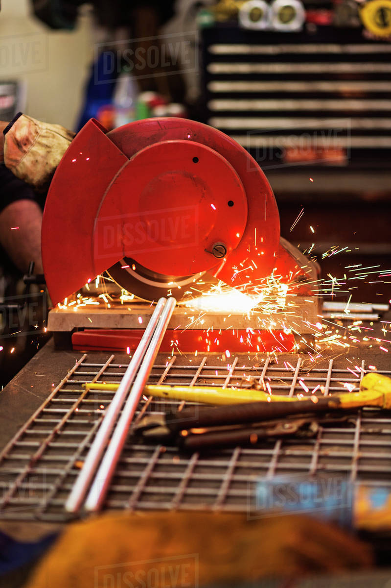 Close-up of welder grinding - Stock Photo - Dissolve