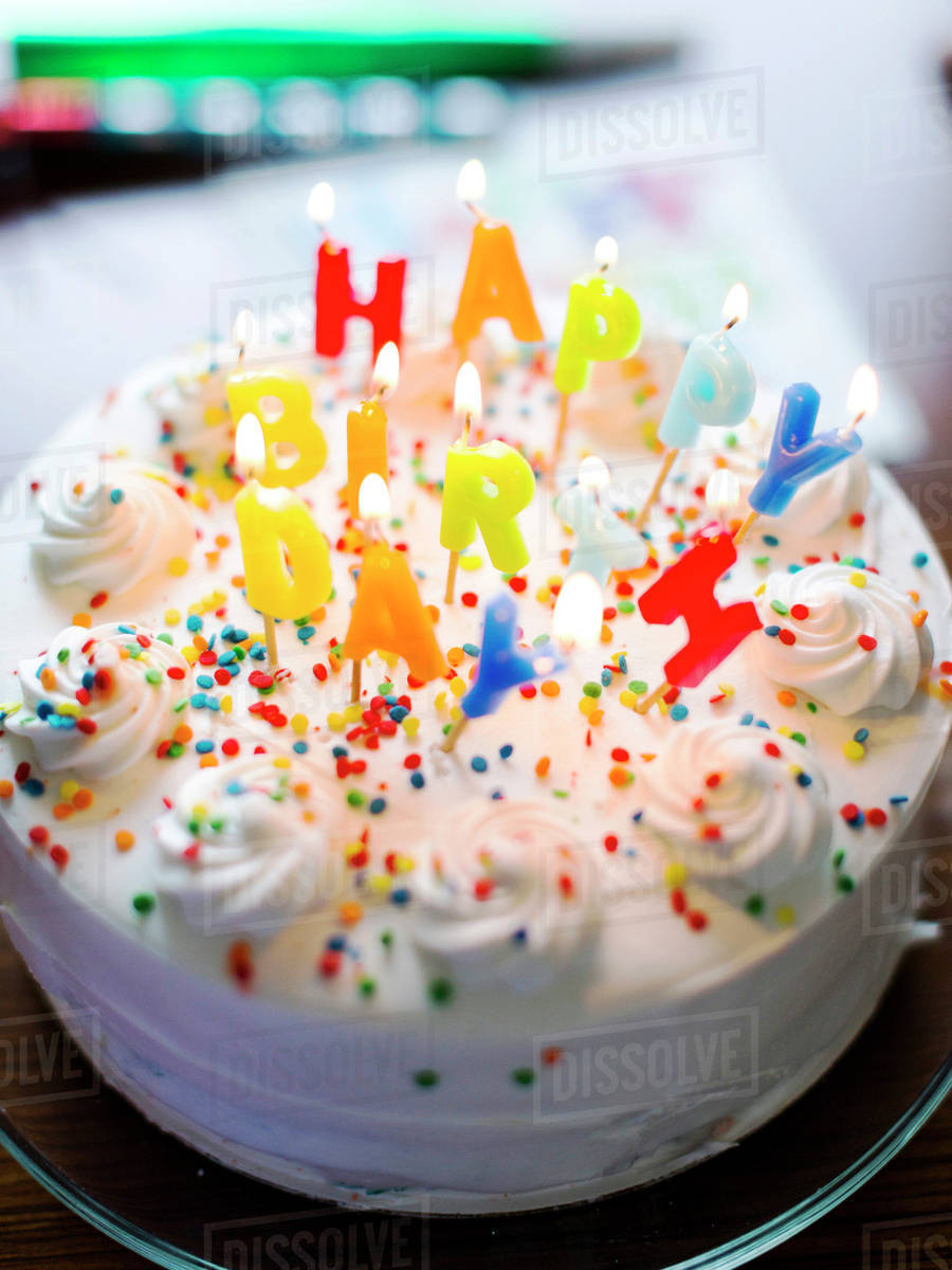 Birthday cake on table - Royalty-free Stock Photo | Dissolve