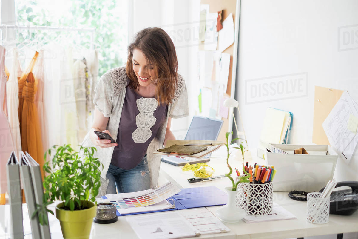 Female fashion designer in her office - Royalty-free Stock Photo | Dissolve