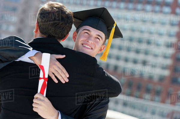 Father with teenage sun (16-17) at graduation ceremony - Royalty-free ...