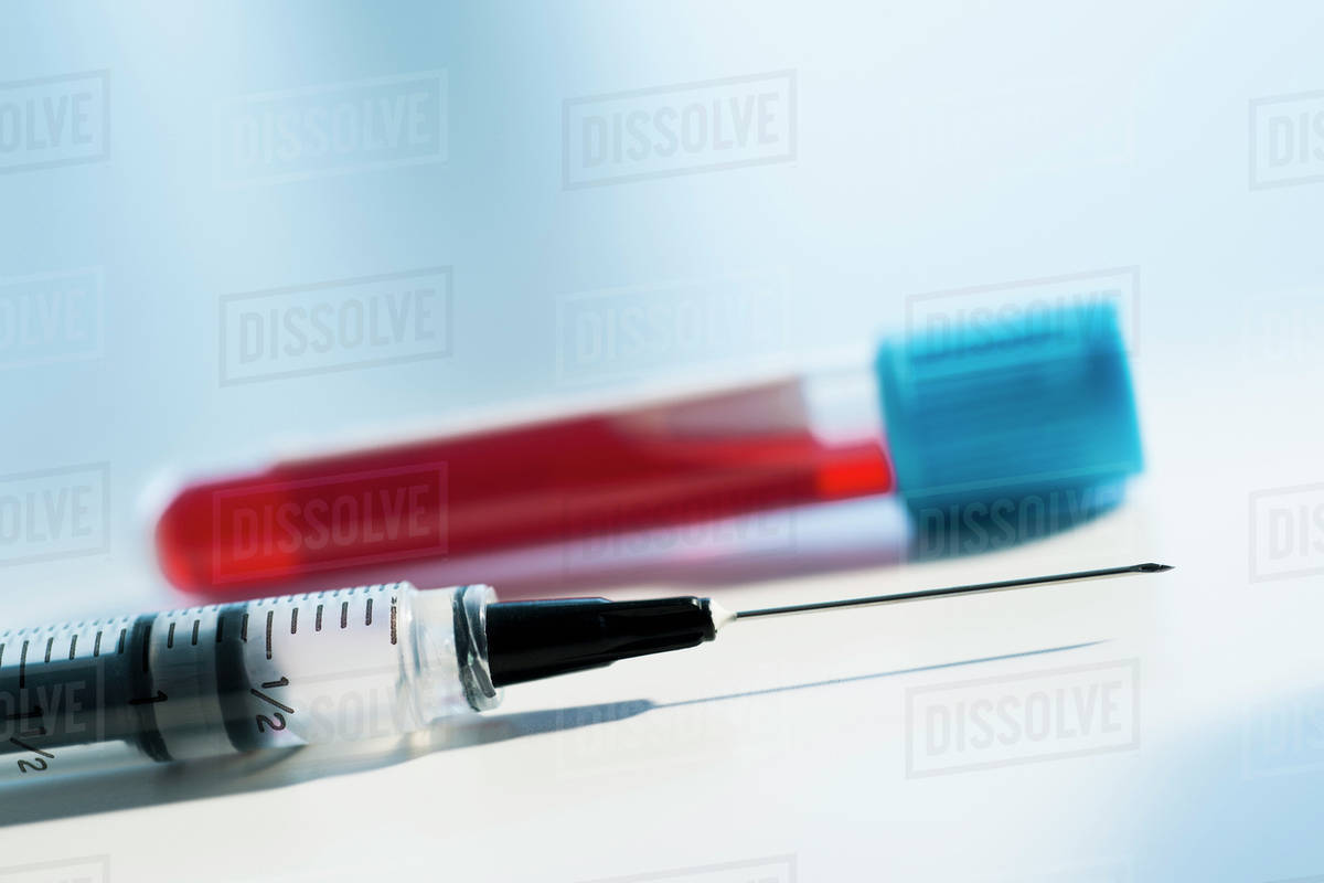 Studio shot of blood sample and syringe - Royalty-free Stock Photo ...