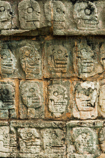 Mayan carvings representing human skulls - Stock Photo - Dissolve